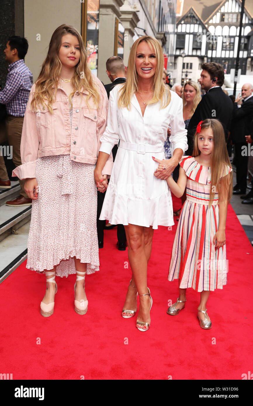 Amanda Holden arriving for the press night with her two daughters ...
