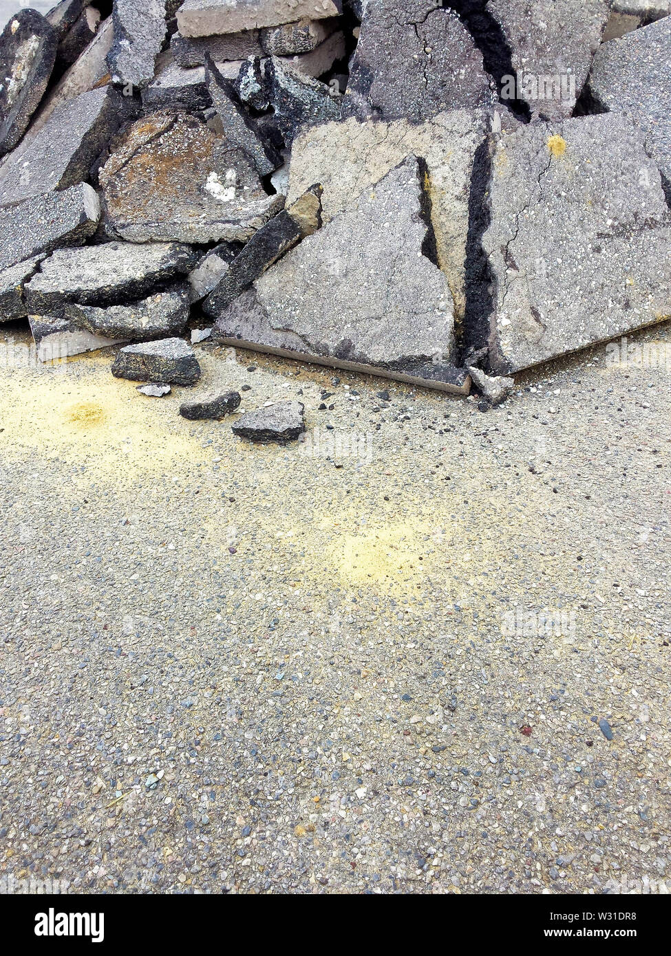 Cracked asphalt pieces background - concept image Stock Photo - Alamy