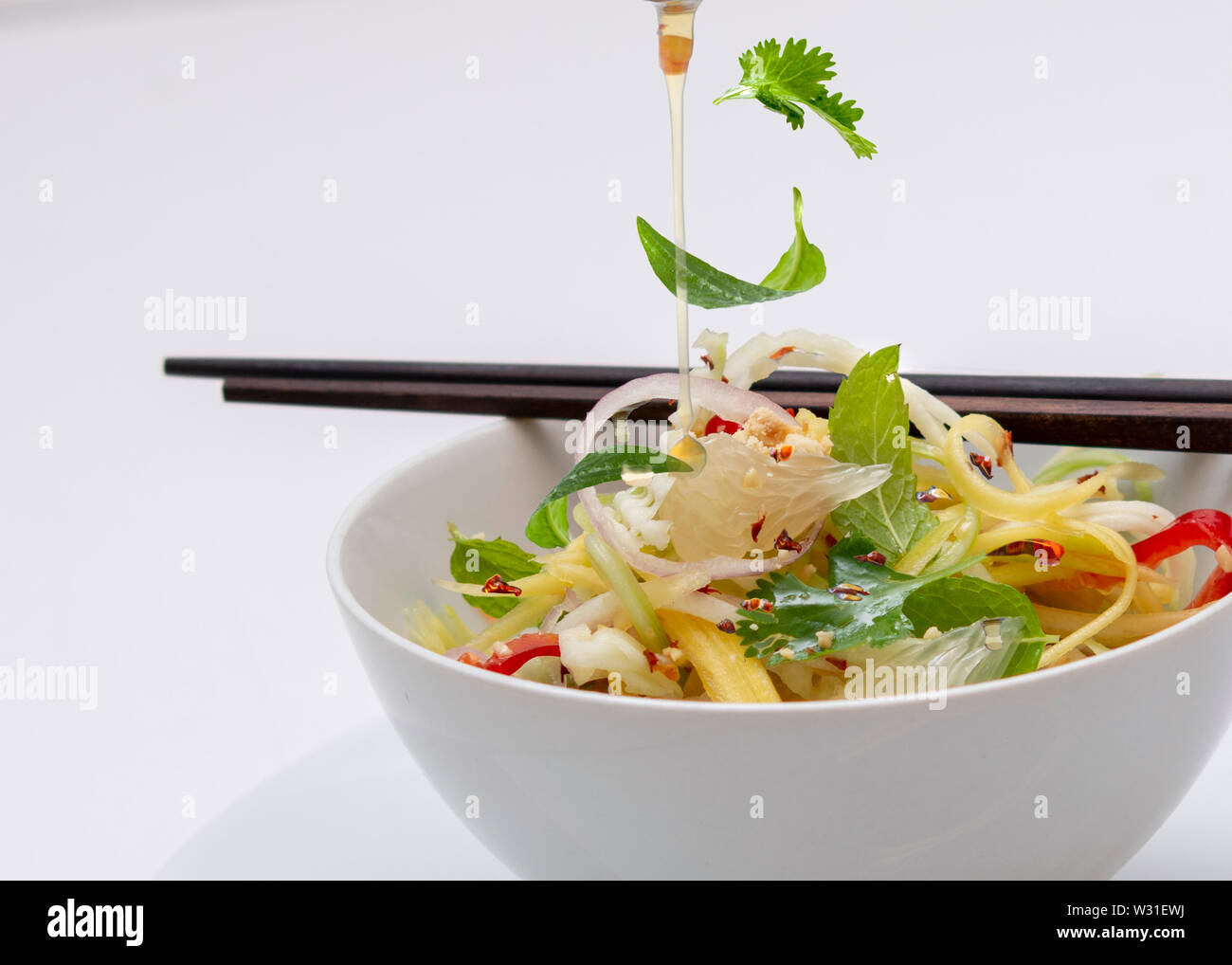 asian seald bowls and plates consisting of a thai glass noodle salad, a ...