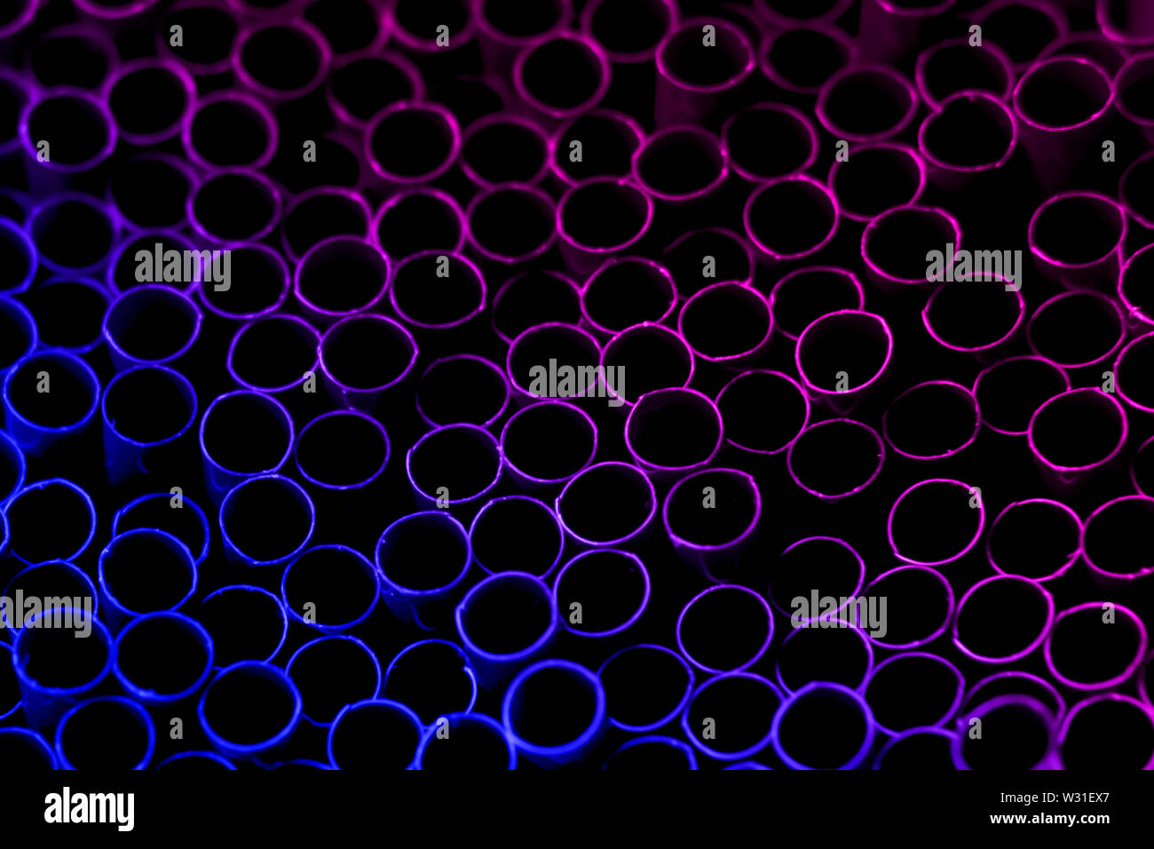 Stainless steel straws vertical abstract background. Metal pipes bundle ...