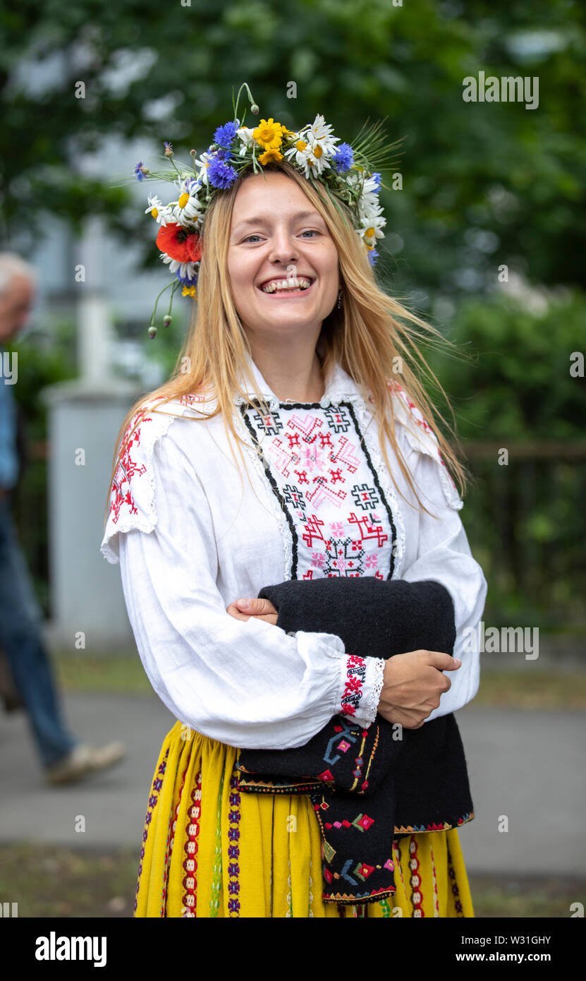 Tallinn, Estonia, 6th July, 2019: young lady in traditional estonian ...