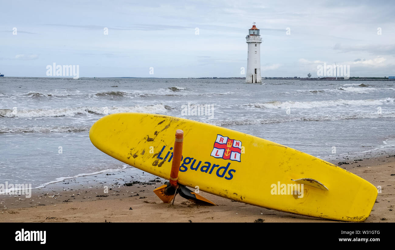 Lifeguards surfboard laid ready for action at New Brighton Stock Photo ...