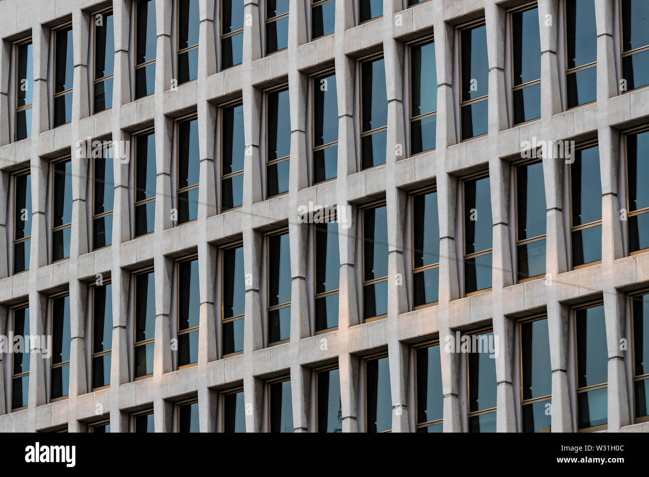 Background of the windows and balconies of the multi-storey building ...