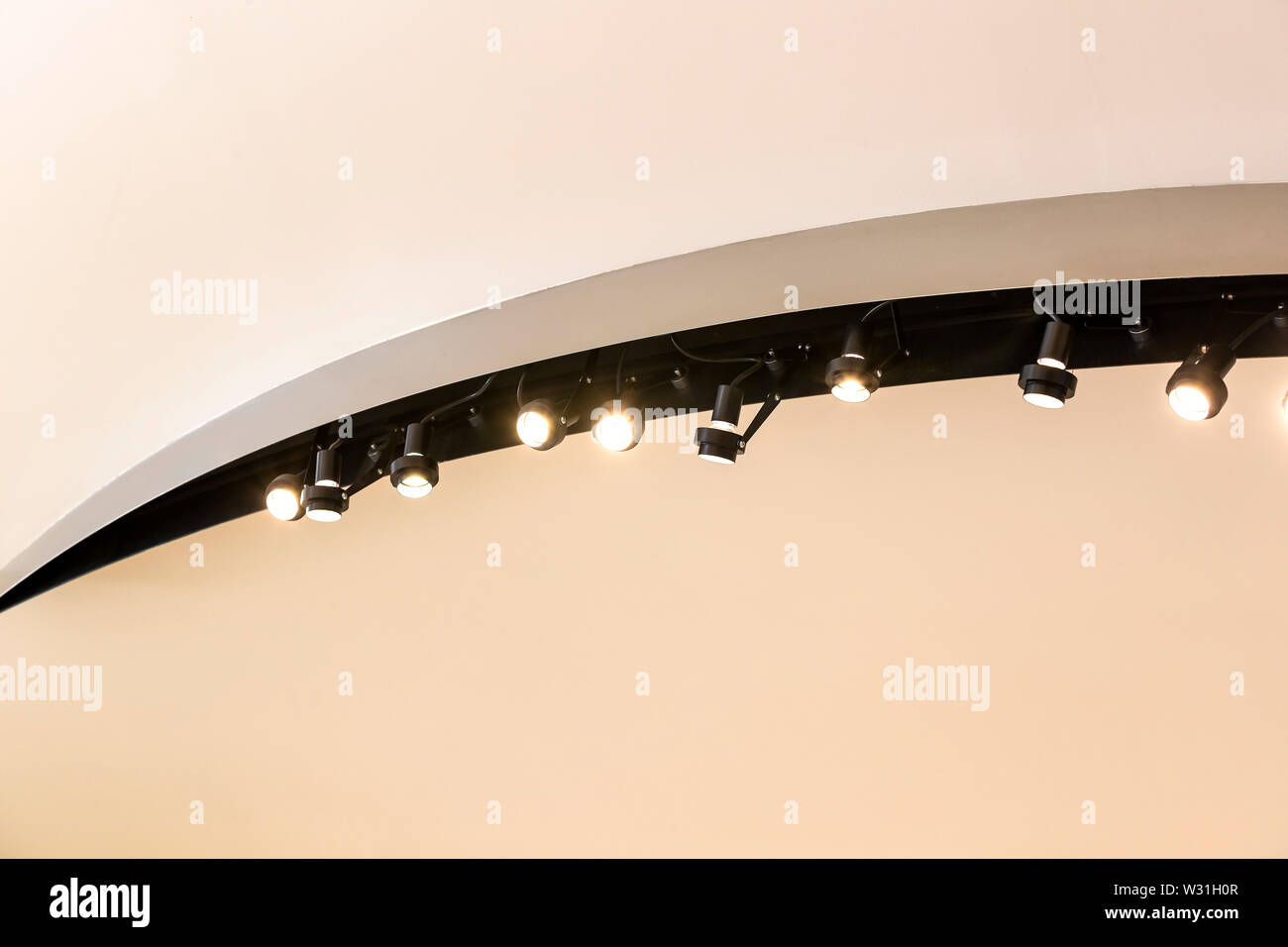 A series of ceiling lamps with halogen lamps Stock Photo - Alamy