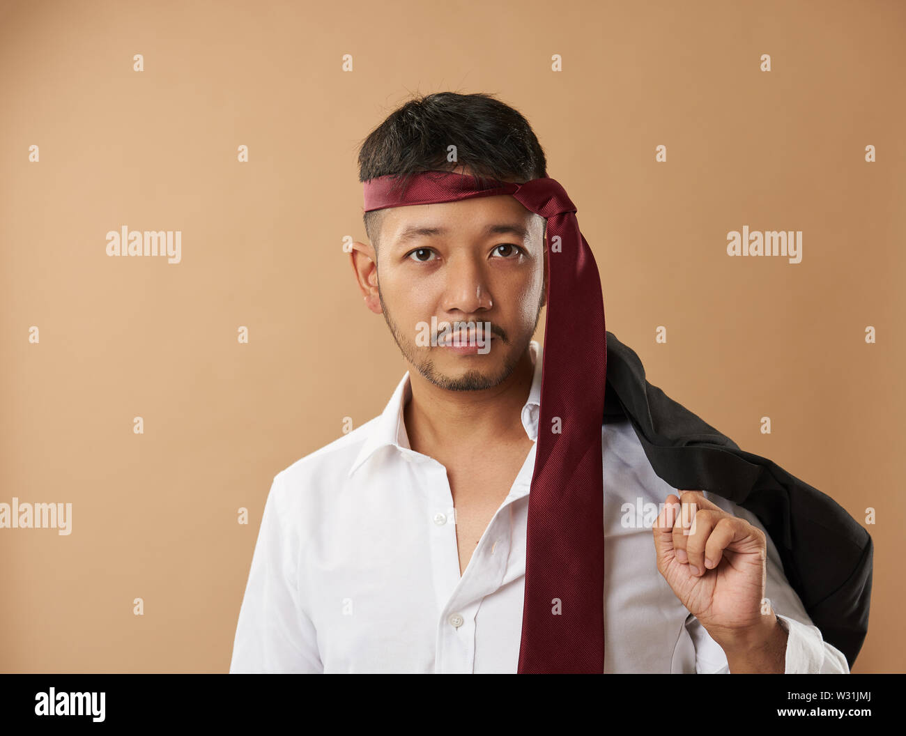 Serious drunk guy after party neck tie color background Stock Photo - Alamy