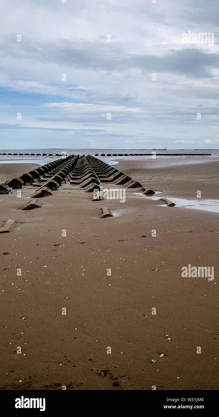 Groynes and sea defences at New Brighton Stock Photo - Alamy