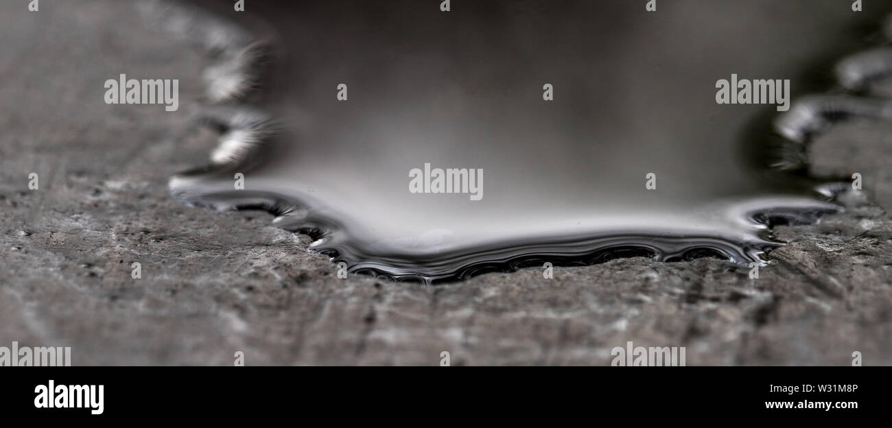 small water puddle background Stock Photo - Alamy