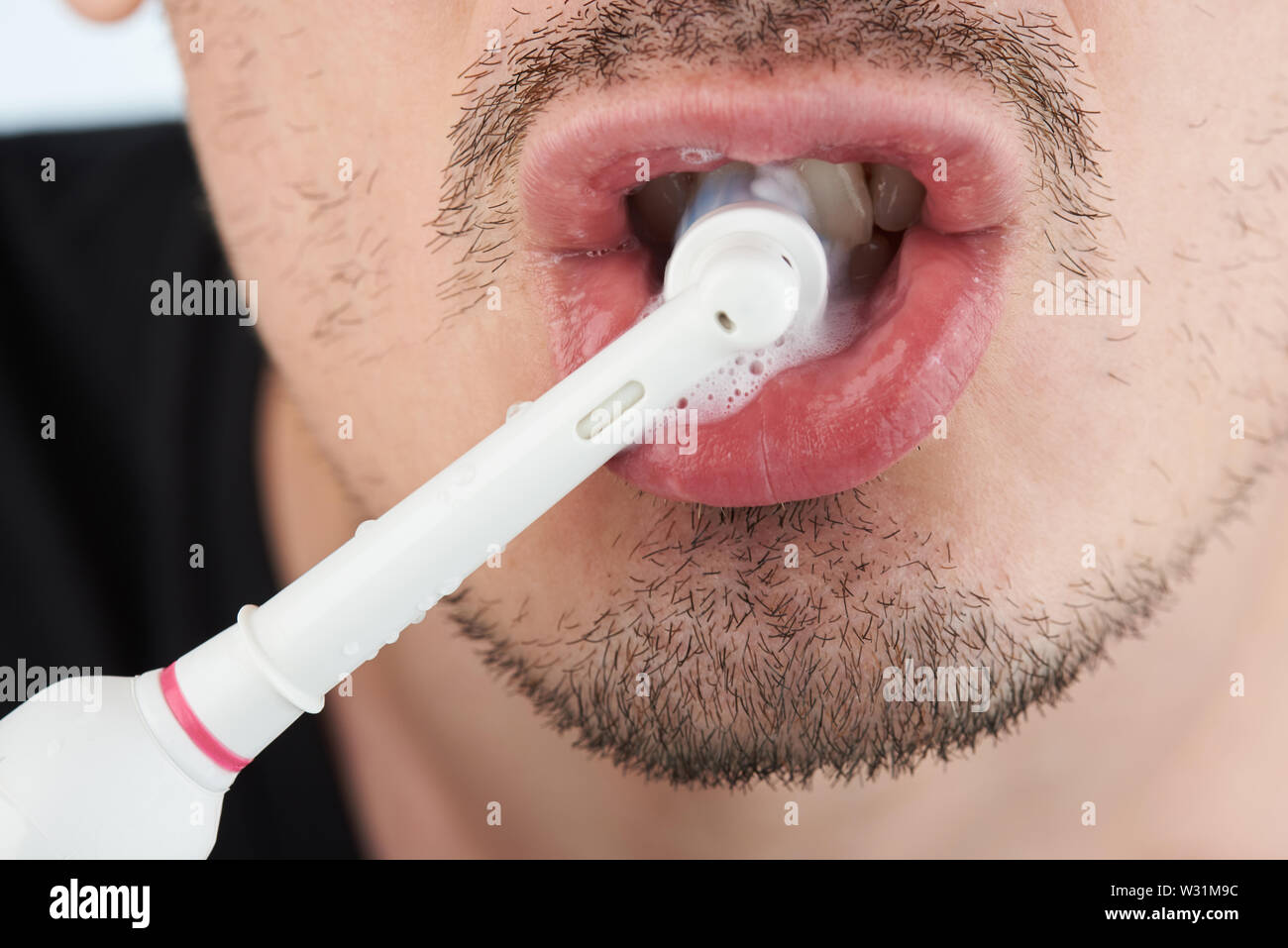 Brushing teeth before sleep close up view Stock Photo - Alamy