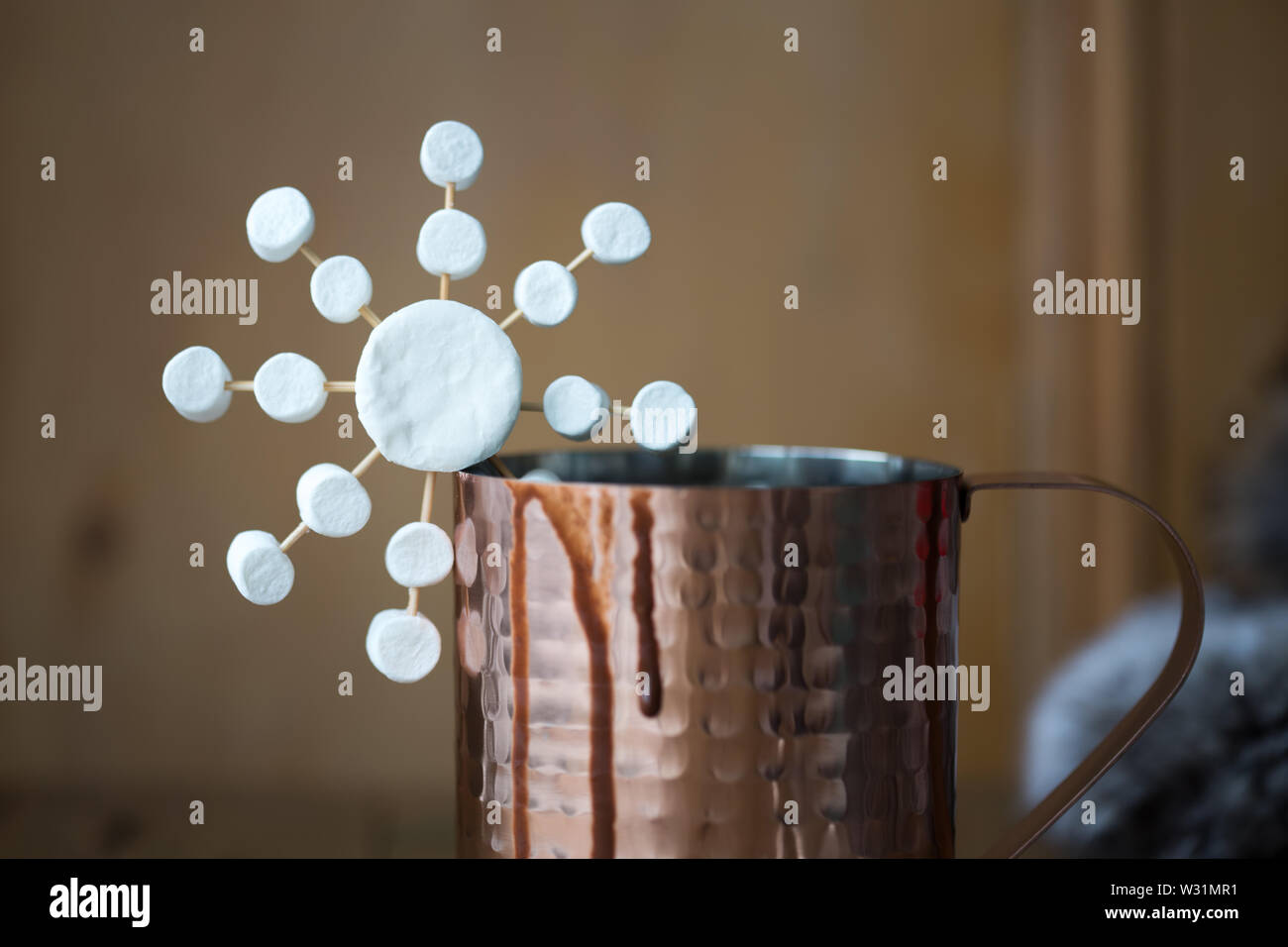 Hot chocolate decorated with a marshmallow snowflake Stock Photo - Alamy