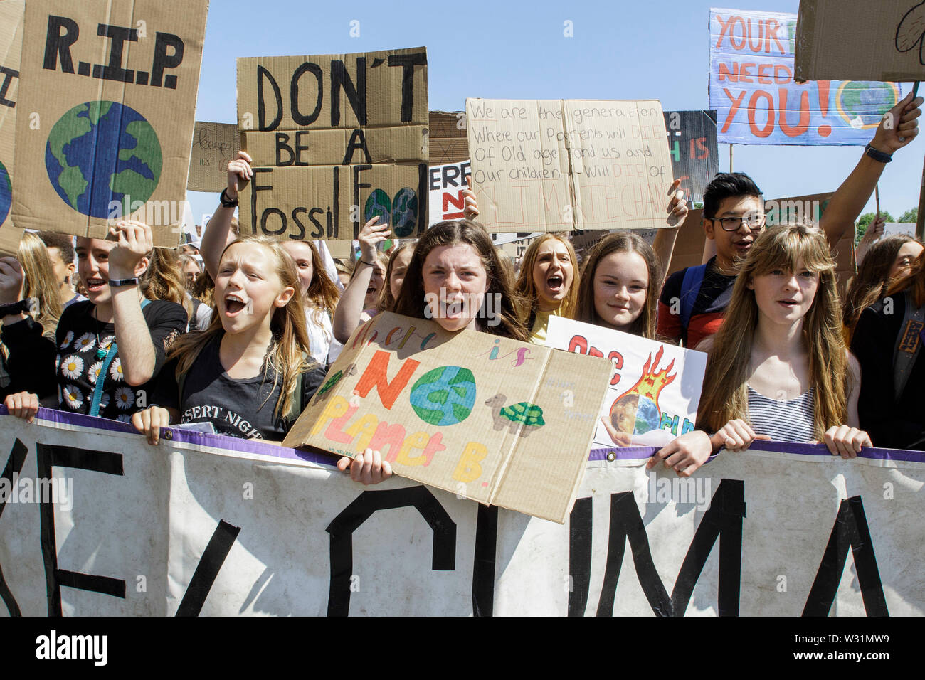Bath college students and school kids carrying climate change placards ...