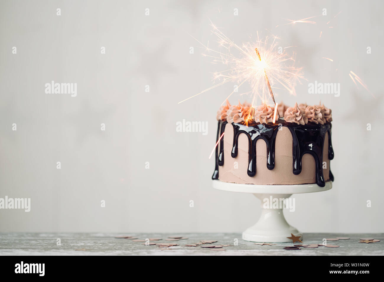 Chocolate drip cake with sparkler for a birthday or celebration Stock ...