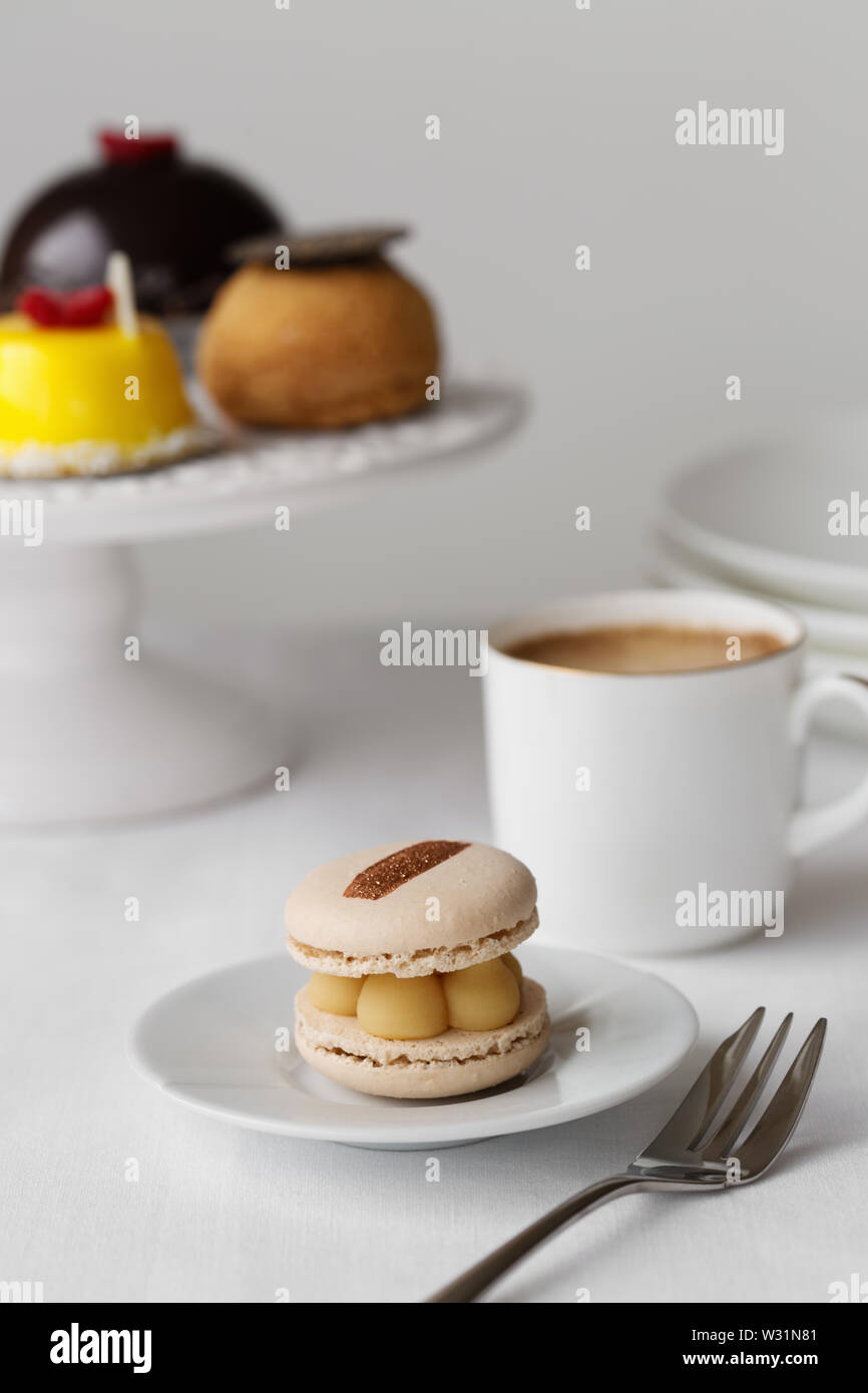 Elegant afternoon tea with cakes and macaron Stock Photo - Alamy