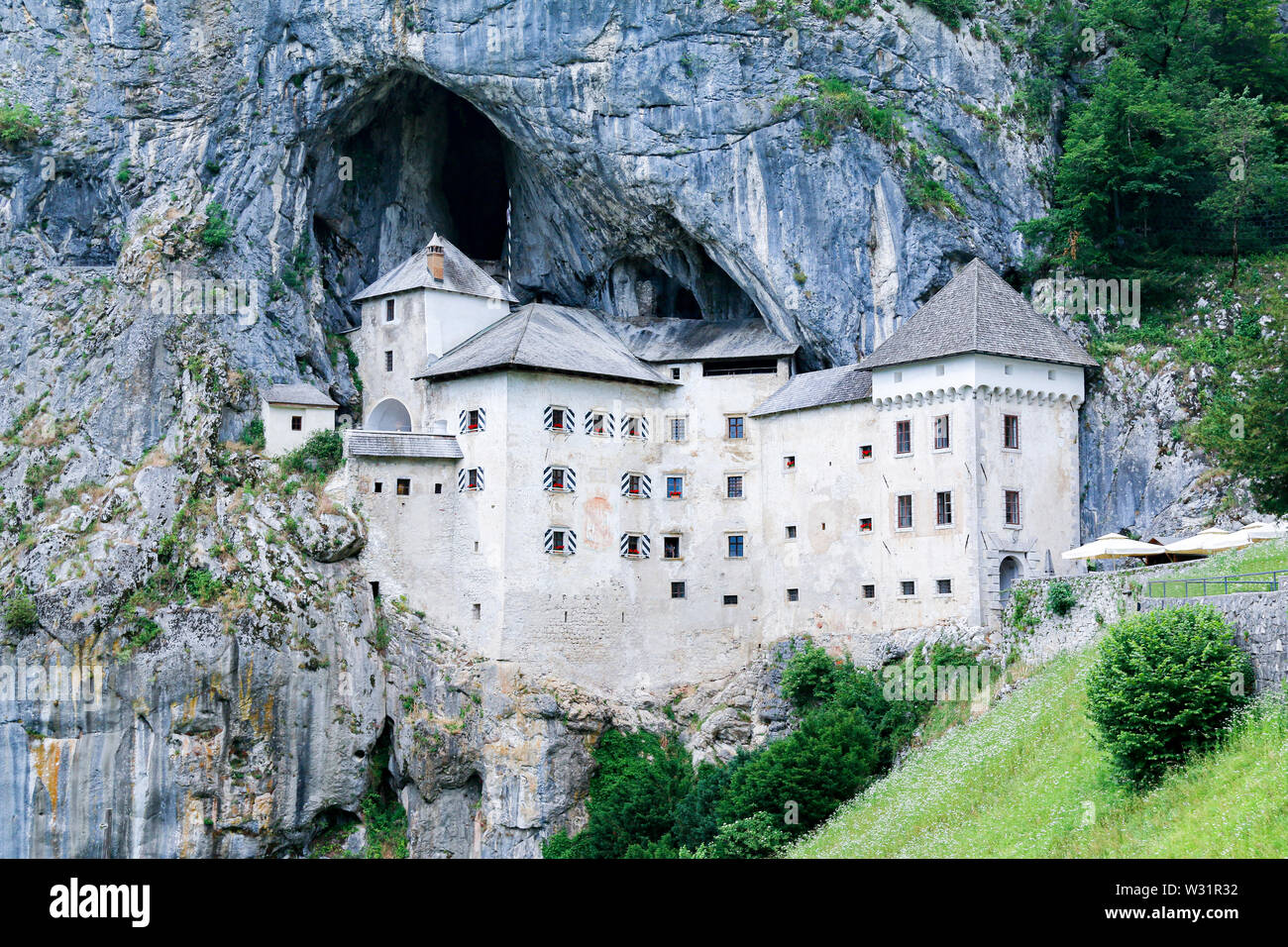 Predjama Castle, a medieval castle, built in the mouth of a cave on a ...