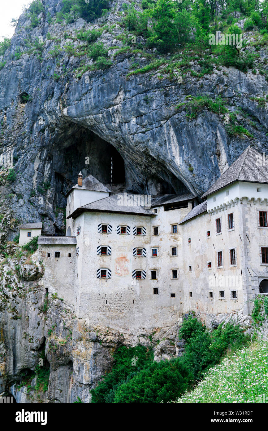 Predjama Castle, a medieval castle, built in the mouth of a cave on a ...