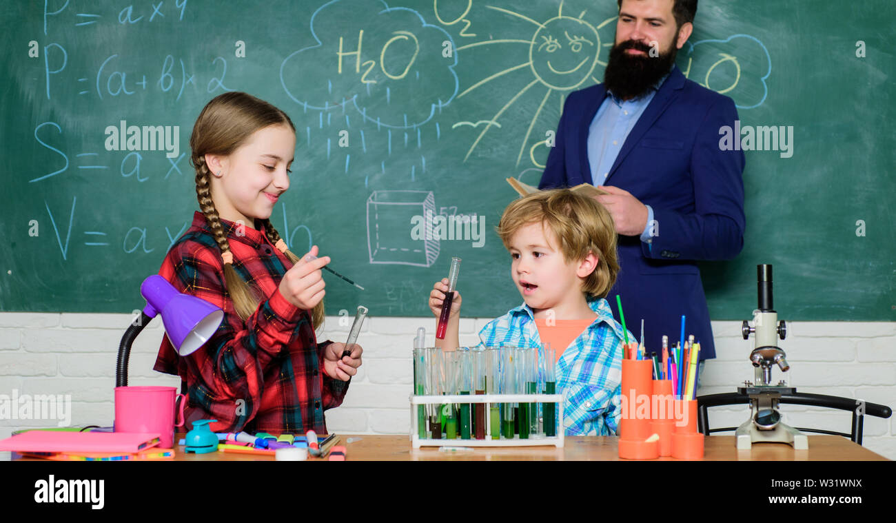 Confident medical experts. happy children teacher. doing experiments ...