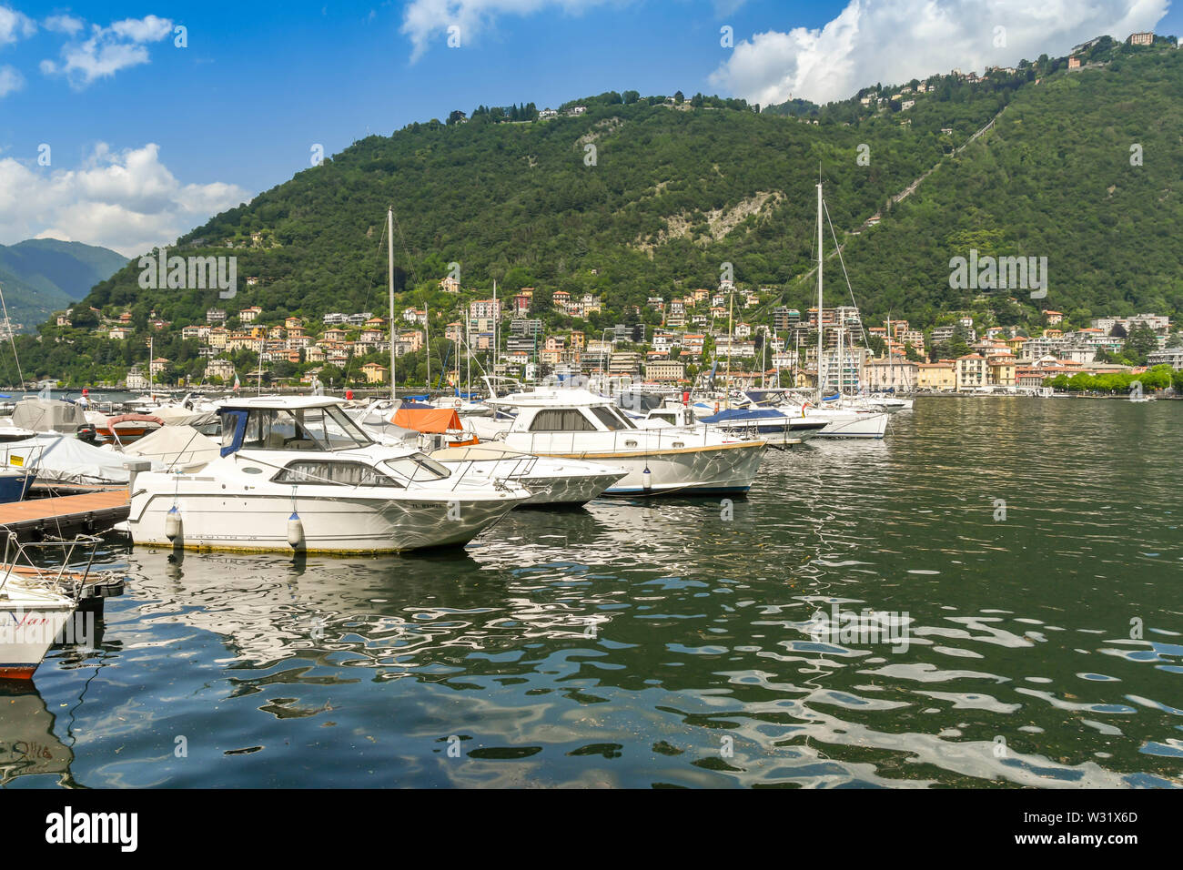 COMO, ITALY - JUNE 2019: Motor boats in the harbour in Como on Lake ...