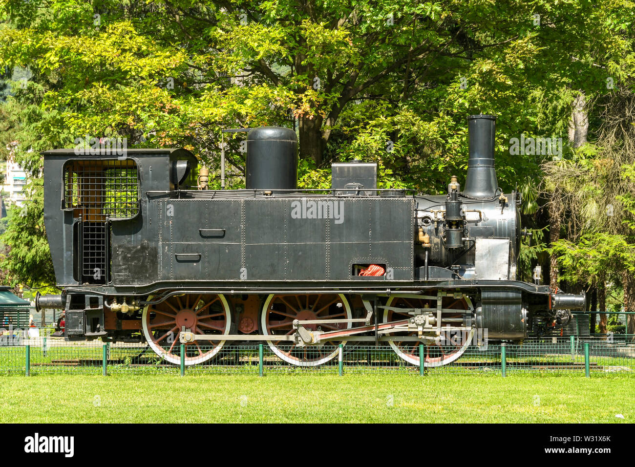 COMO, ITALY - JUNE 2019: Old steam locomotive preserved and on display ...