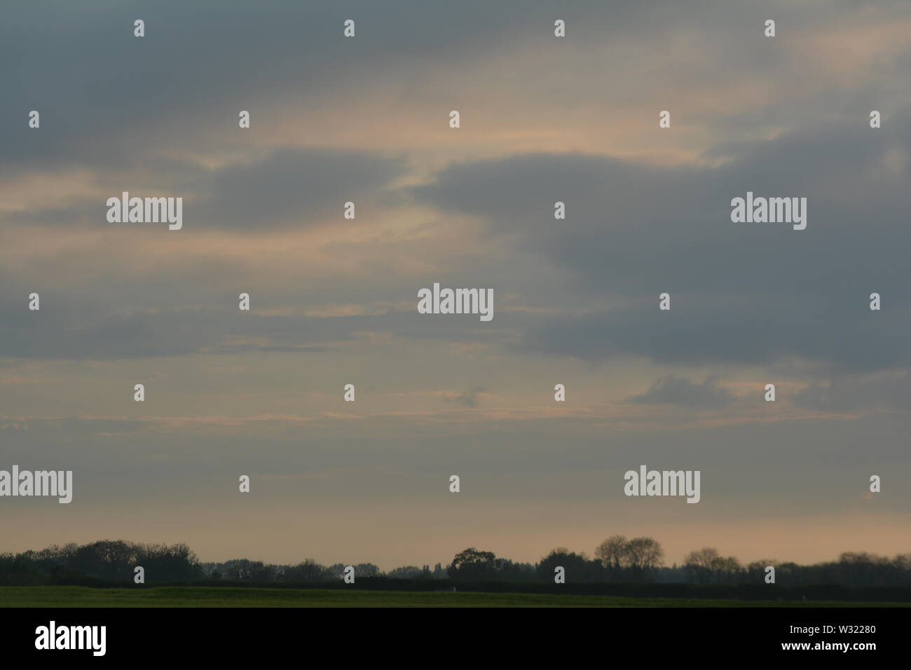 majestic sweeping evening clods in the sky over the landscape of ...