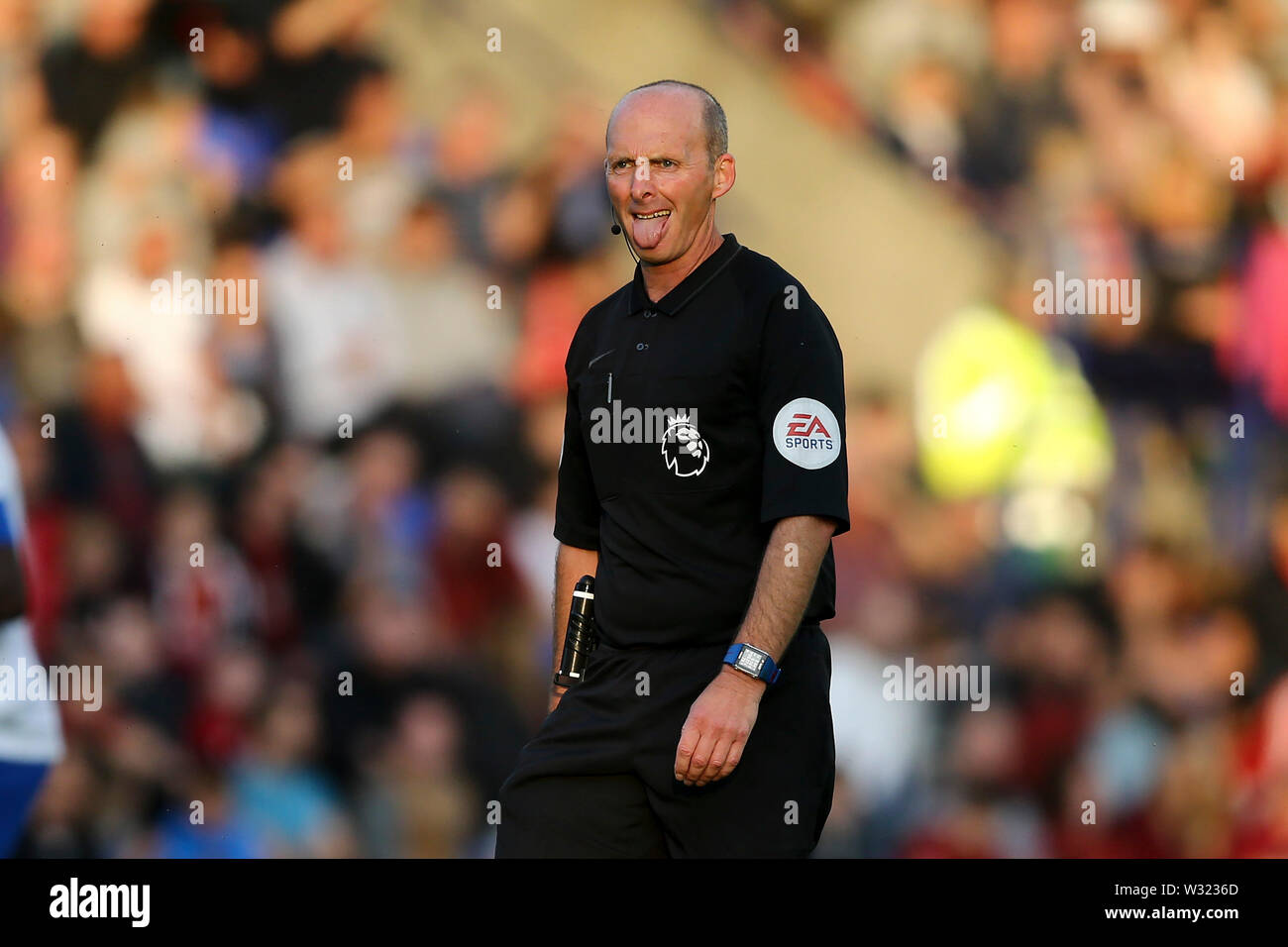 Birkenhead, UK. 11th July, 2019. Referee Mike Dean looks on sticking ...
