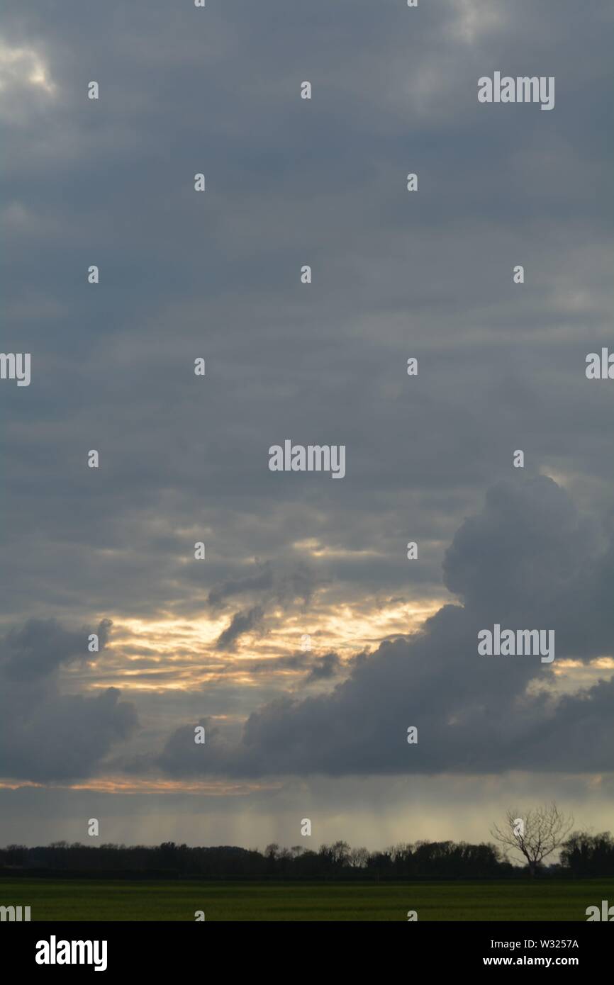 cloudy evening sky with mix of clouds and subtle lighting Stock Photo ...