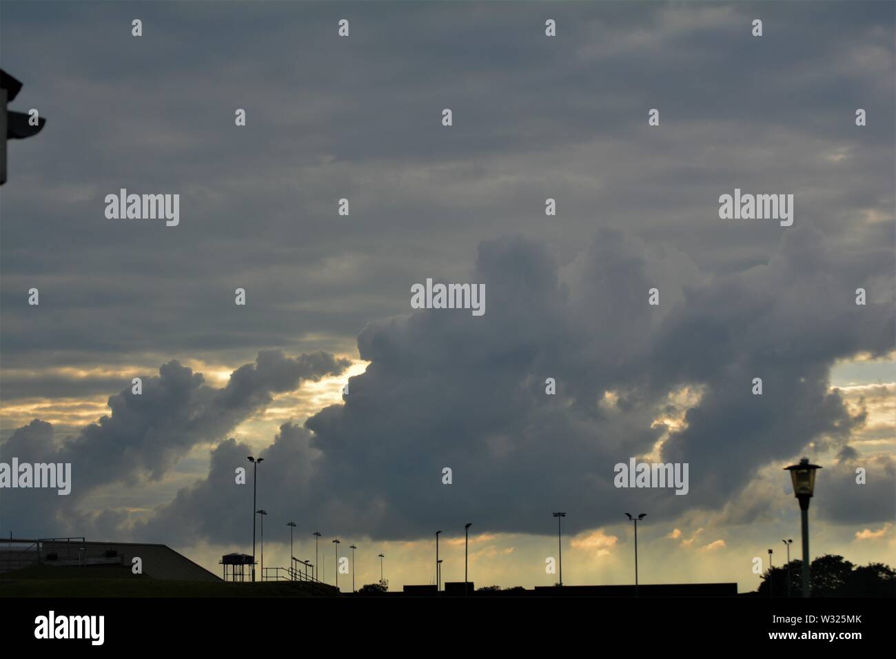 cloudy evening sky with mix of clouds and subtle lighting Stock Photo ...