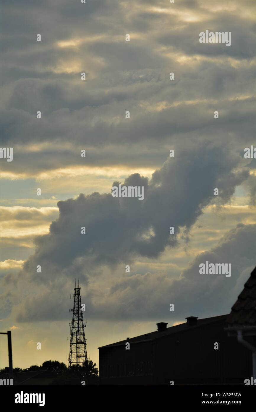 cloudy evening sky with mix of clouds and subtle lighting Stock Photo ...