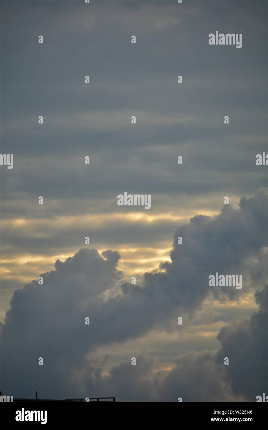 cloudy evening sky with mix of clouds and subtle lighting Stock Photo ...