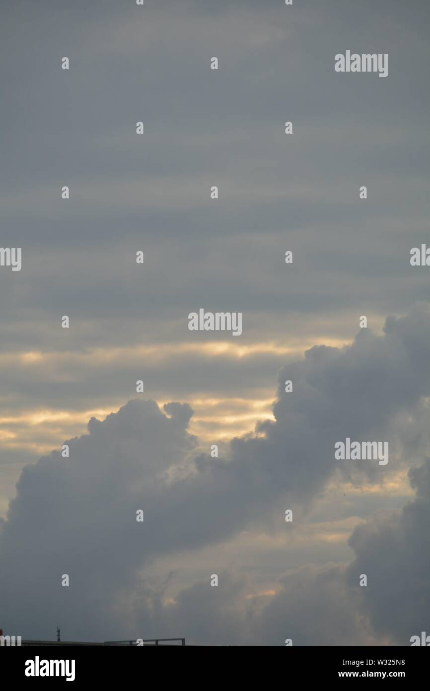 cloudy evening sky with mix of clouds and subtle lighting Stock Photo ...