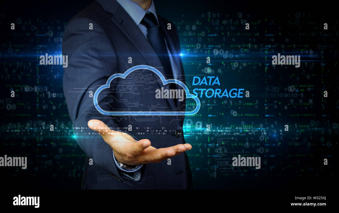 A businessman in a suit touch the screen with cloud symbol hologram ...