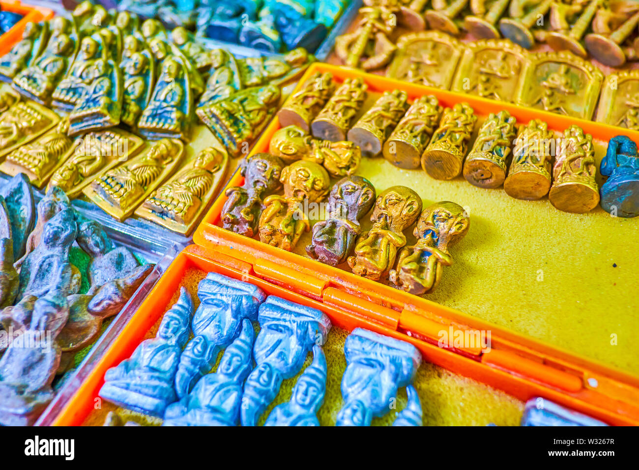 The small stone amulets on buddhist theme are a fine gift from Thailand ...