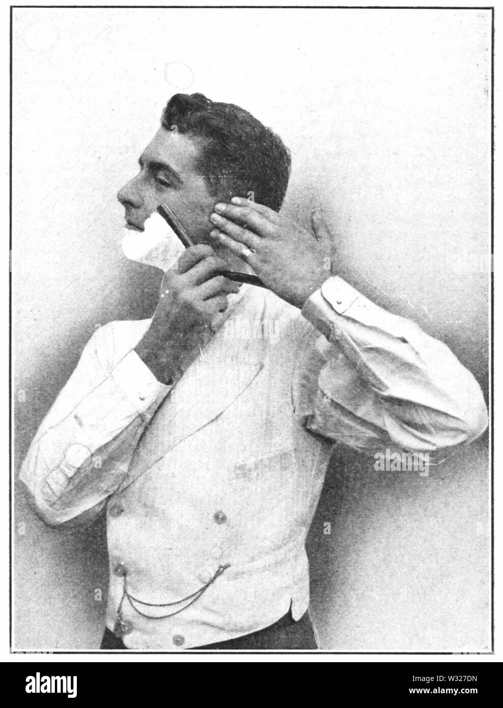 Shaving Made Easy, 1905 - Shaving the left side Stock Photo - Alamy