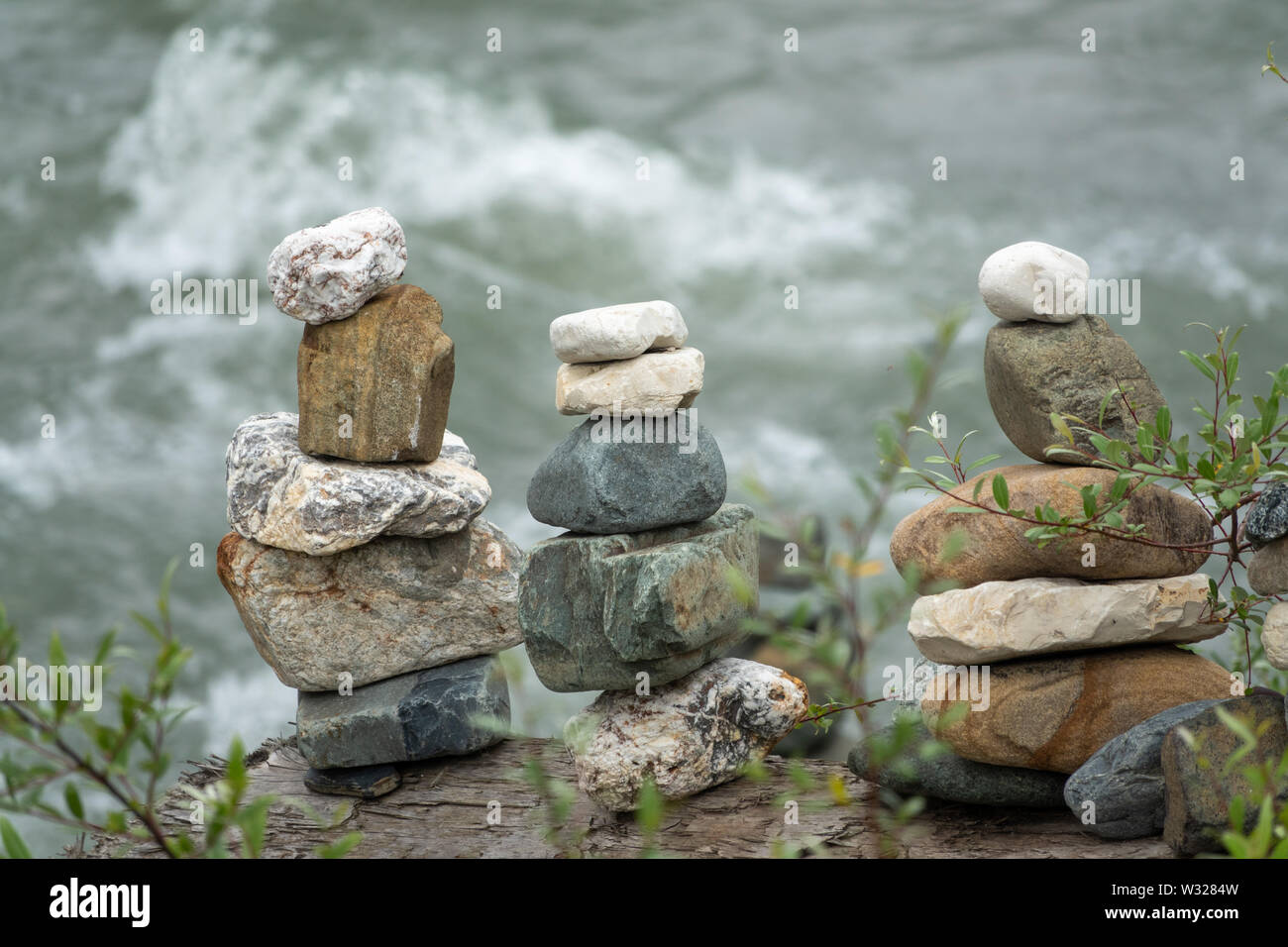 Balancing stones in equilibrium. Meditation and rest on the bank of the ...