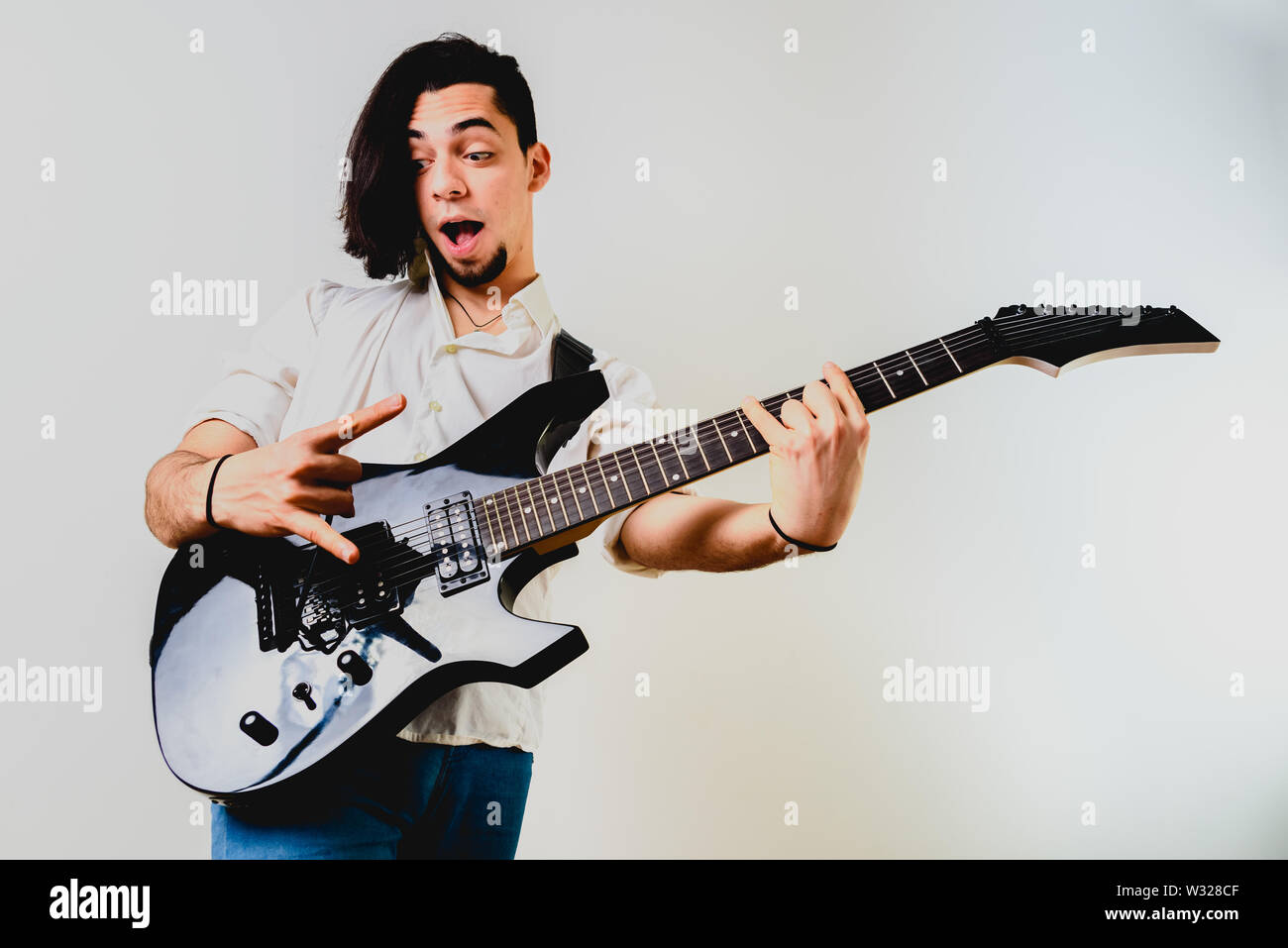 Guitarist playing his electric guitar, isolated background Stock Photo ...