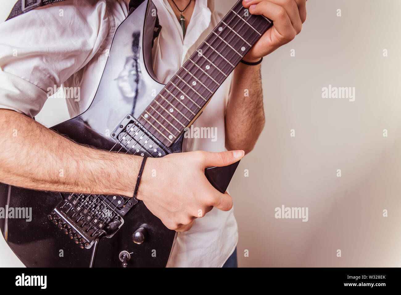 Closeup hand pressing strings hi-res stock photography and images - Alamy