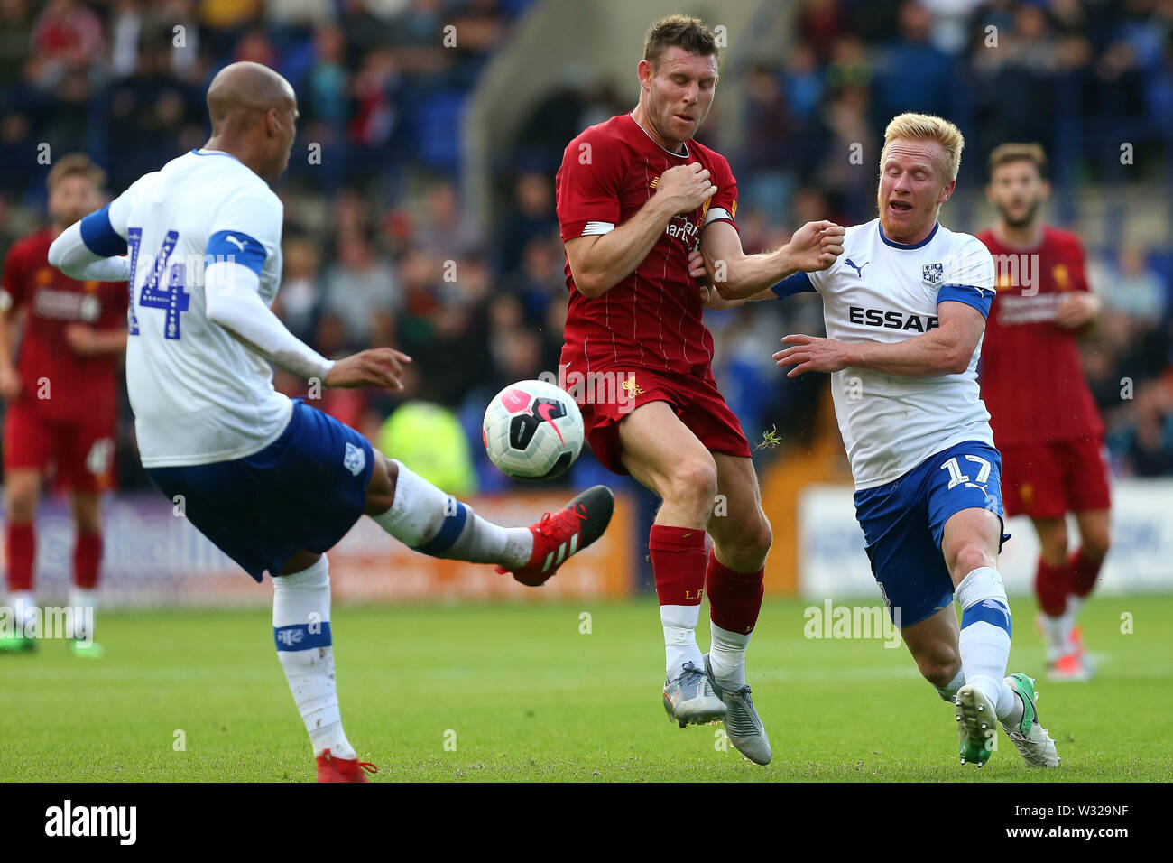 Birkenhead, UK. 11th July, 2019. Jake Caprice of Tranmere Rovers, David ...