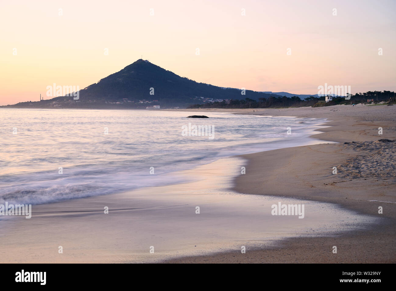 Sunset at the Moledo beach, with a mountain on backgroud Stock Photo ...