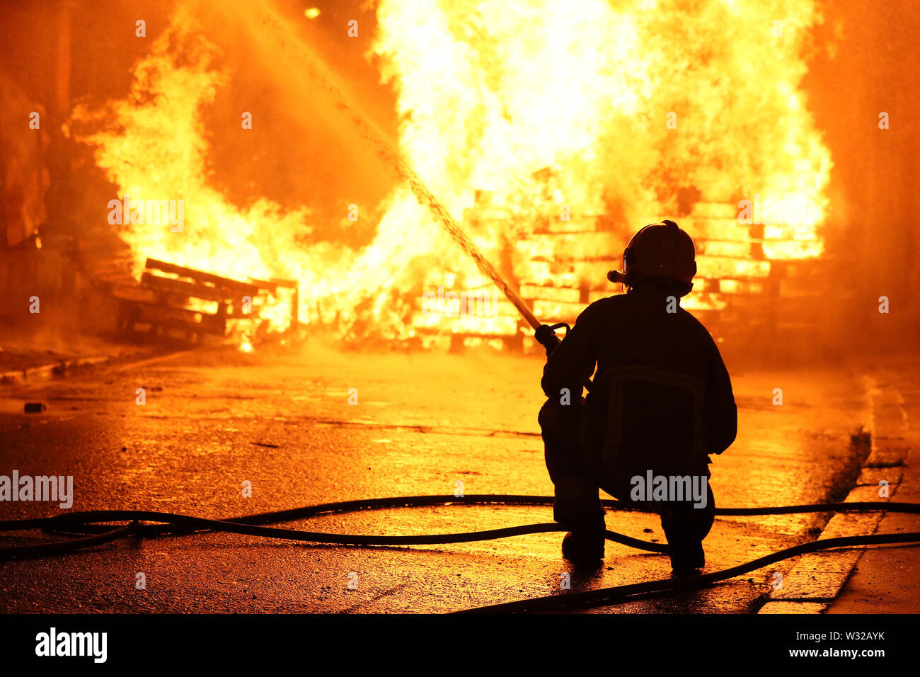 Members of the fire service work to contain an 11th night Bonfire in ...