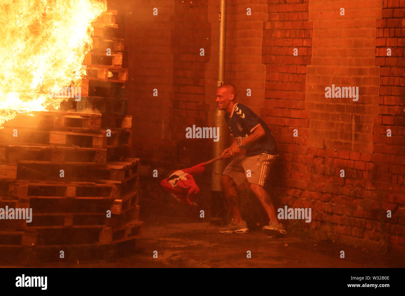 People attend an 11th night Bonfire in Cluan Place, Belfast, as ...