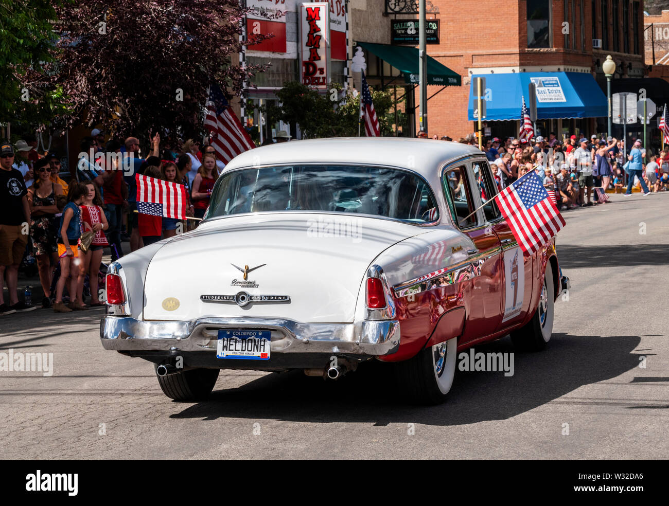1955 Studebaker President classic car driving in the annual Fourth of ...