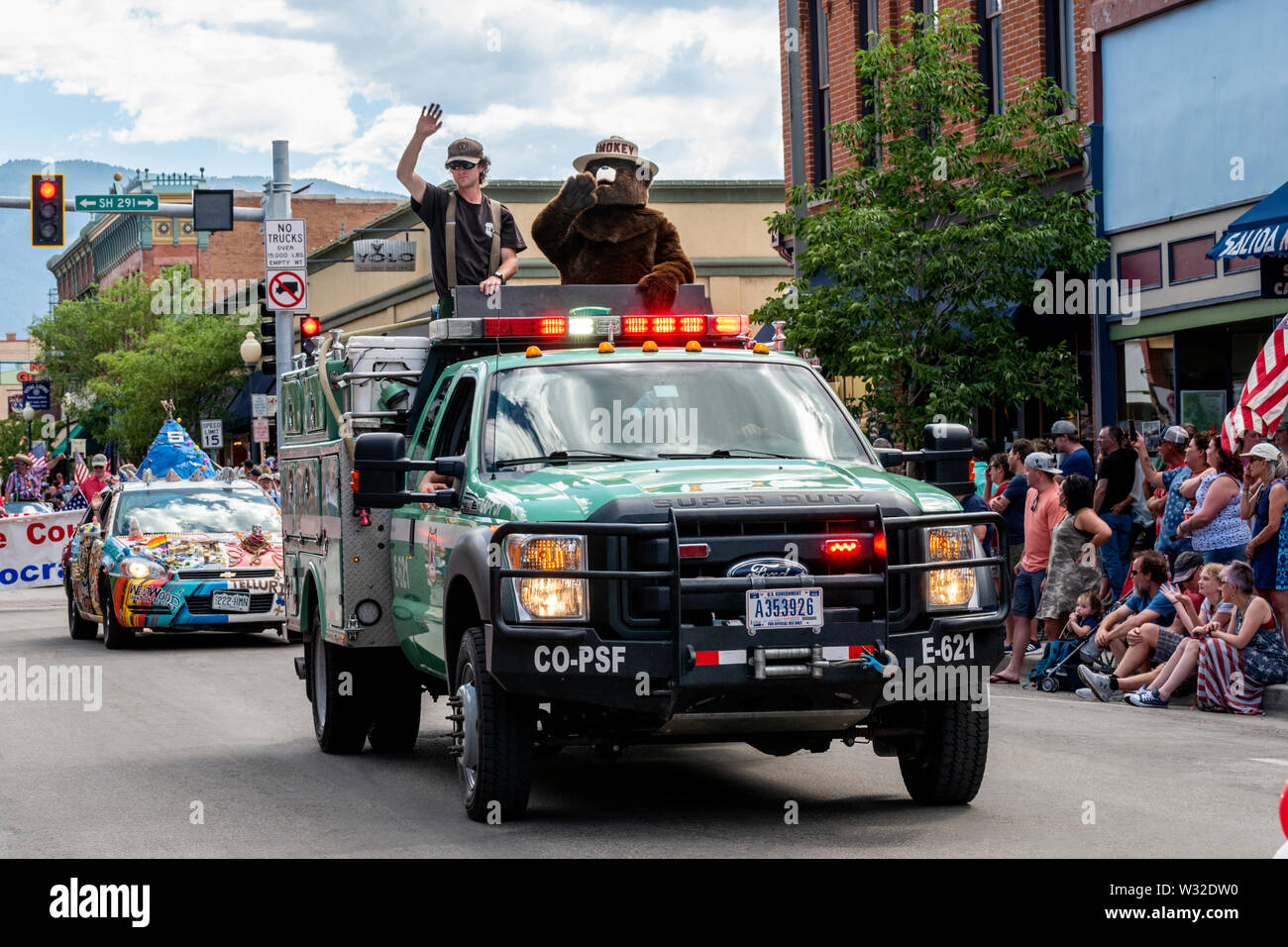 Smokey the Bear rideing in US Forest Service truck; annual Fourth of ...