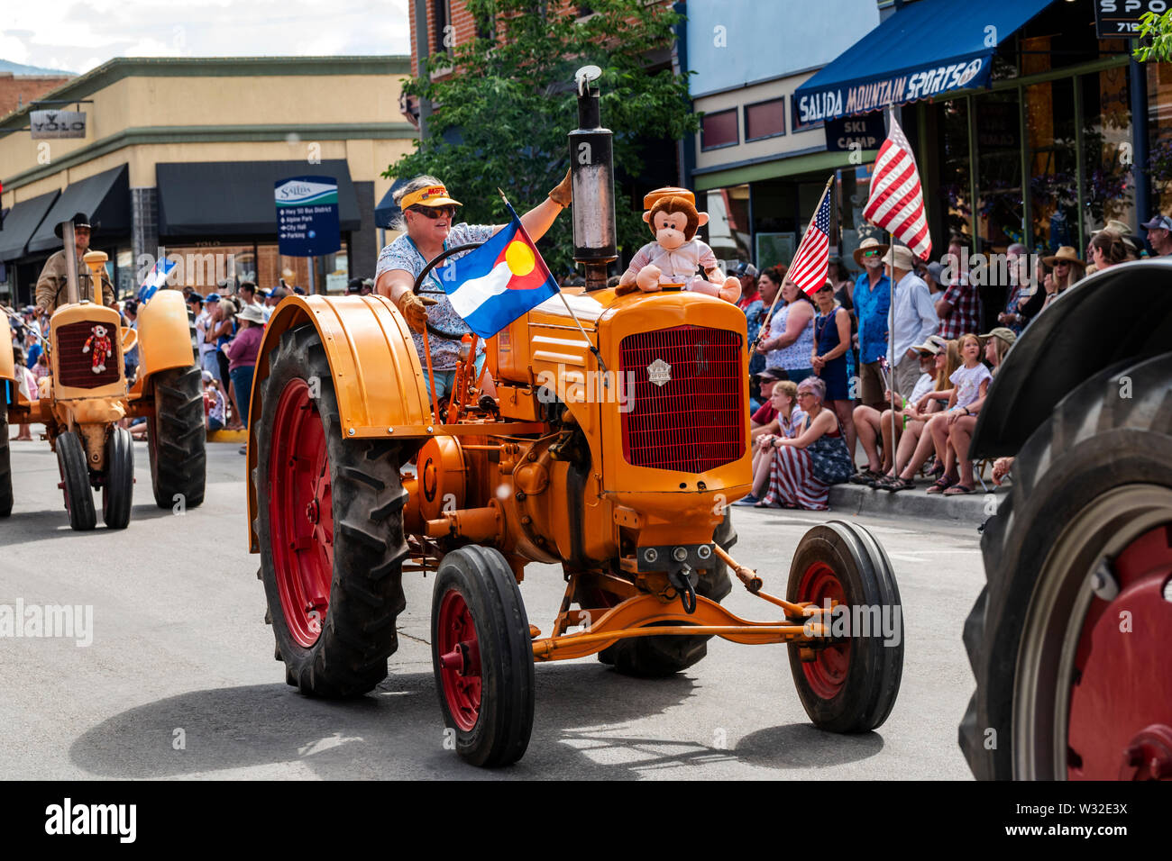 Antique tractors in the annual Fourth of July Parade in the small ...