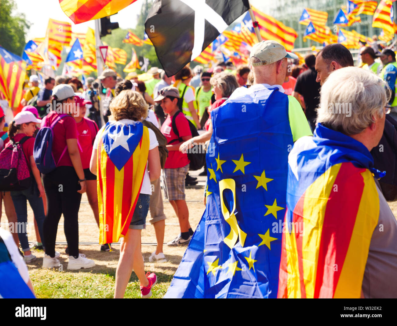 Strasbourg, France - Jul 2 2019: Man wearing EU and Estelada Catalan ...