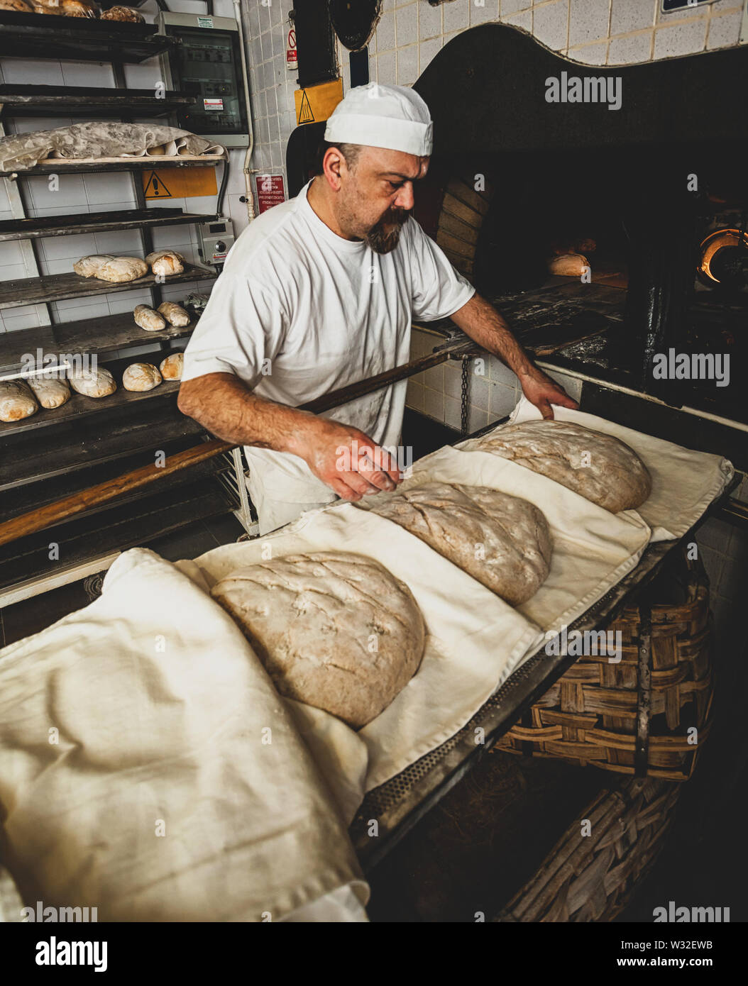Daily production of bread baked with wood oven with traditional method ...
