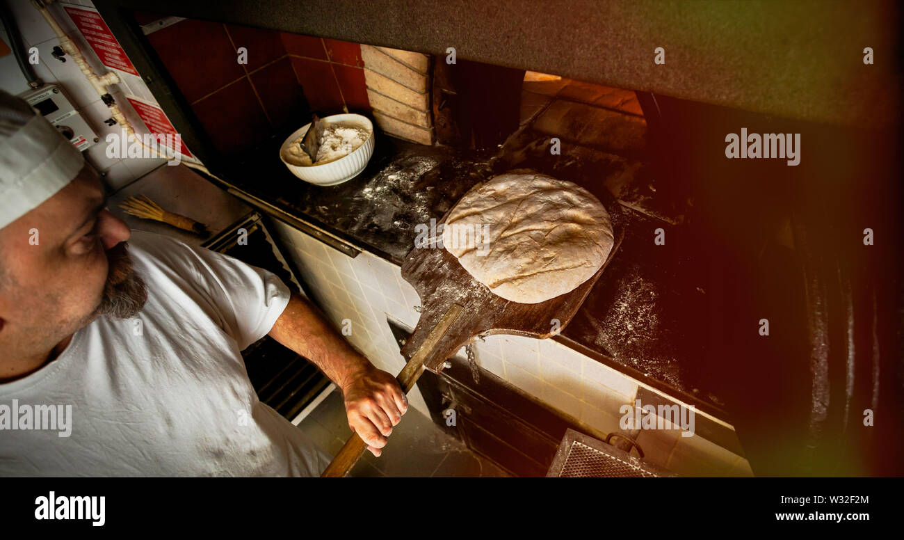 Daily production of bread baked with wood oven with traditional method ...