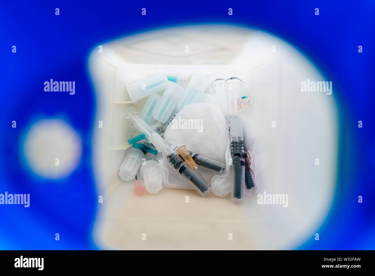 Macro view inside container cleared sharps disposal container with ...