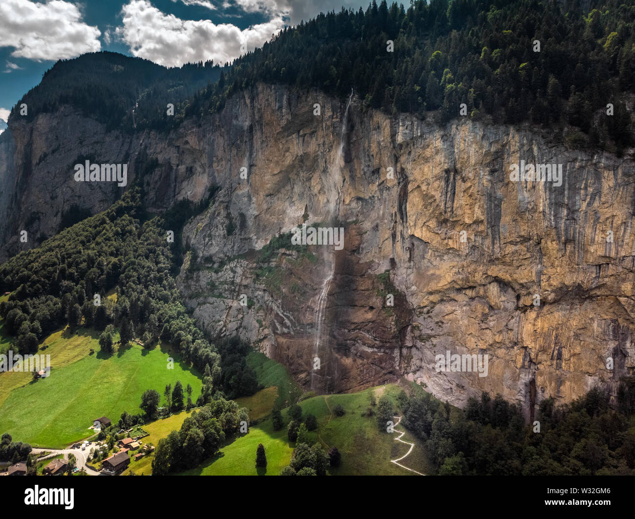 Beautiful Staubbachfall waterfall flowing down the picturesque ...
