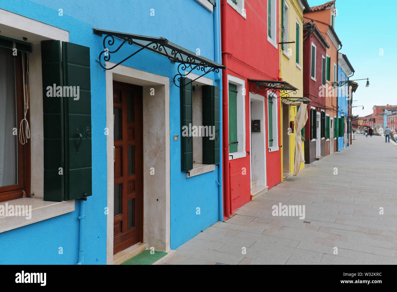Colorful facade entrances of retro houses on a street Stock Photo - Alamy