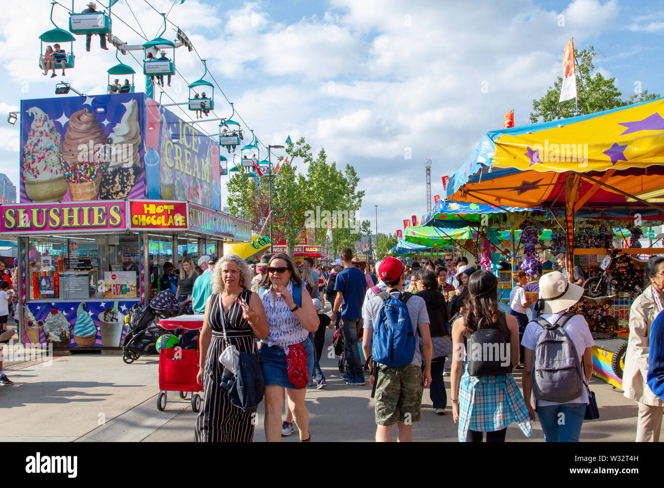 CALGARY, CANADA - JULY 9, 2019: A crowd filled the street on Olympic ...