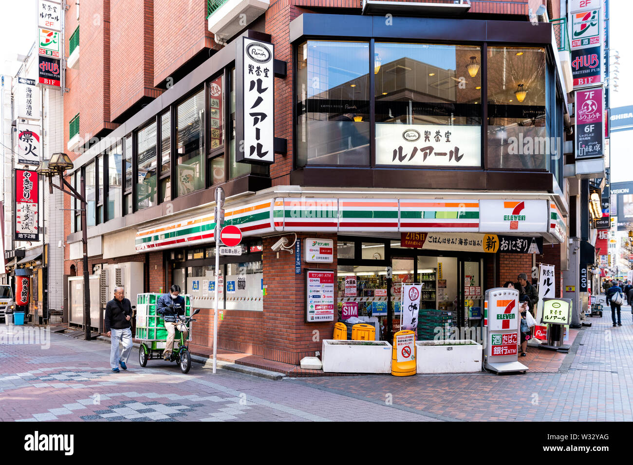 Tokyo, USA - April 4, 2019: Shinjuku city district ward with 7-eleven ...