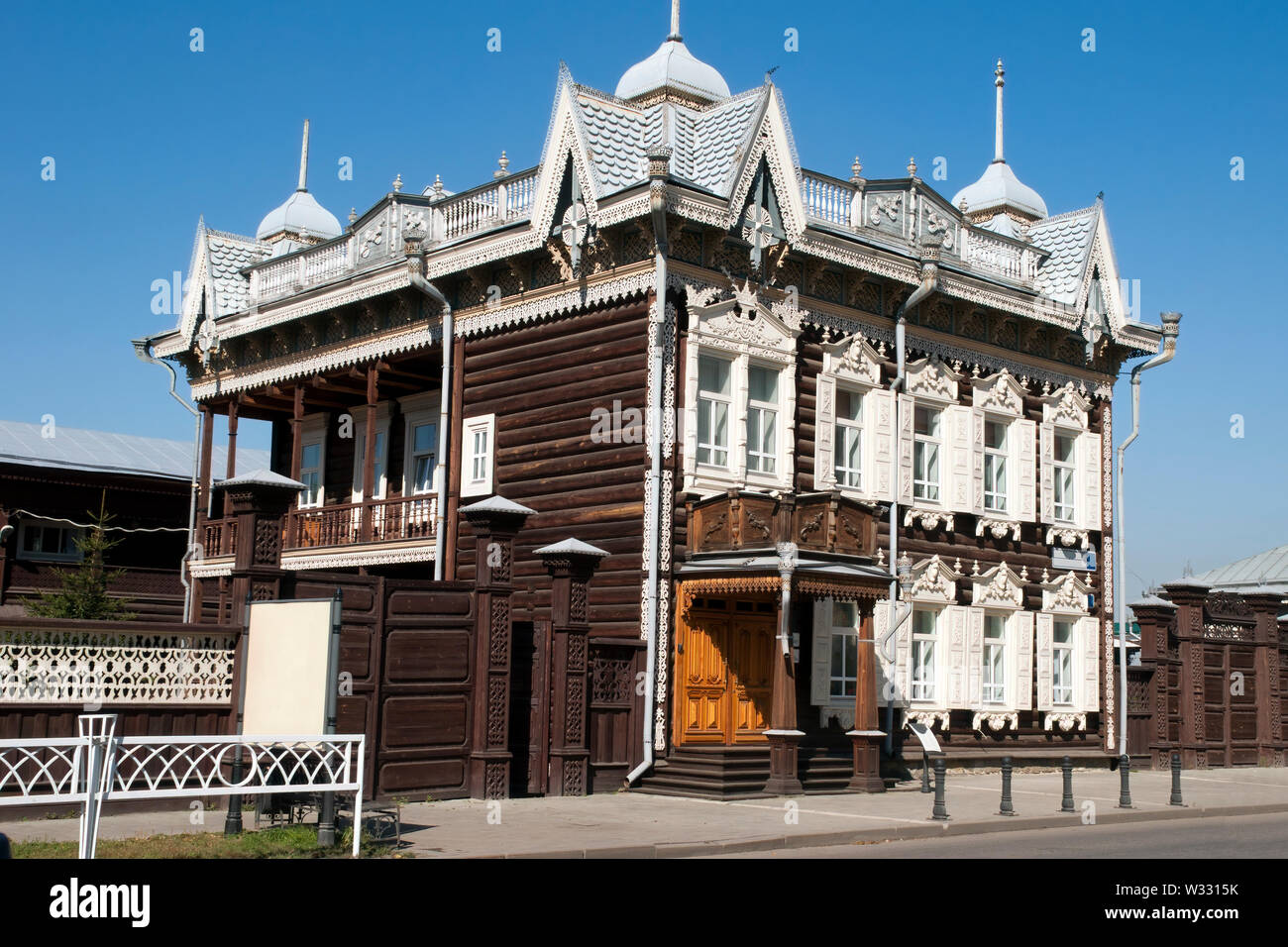Irkutsk Russia, Traditional architecture, log house with carved lacework window decorations ...